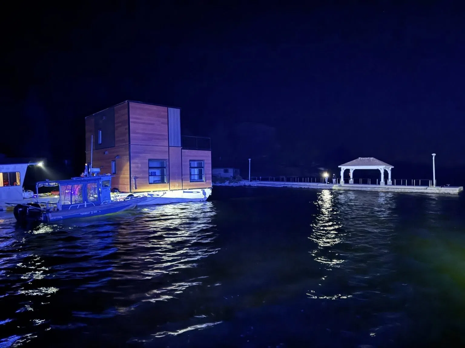 Brighton Marine Rescue tows house on barge safely to shore | Quinte News