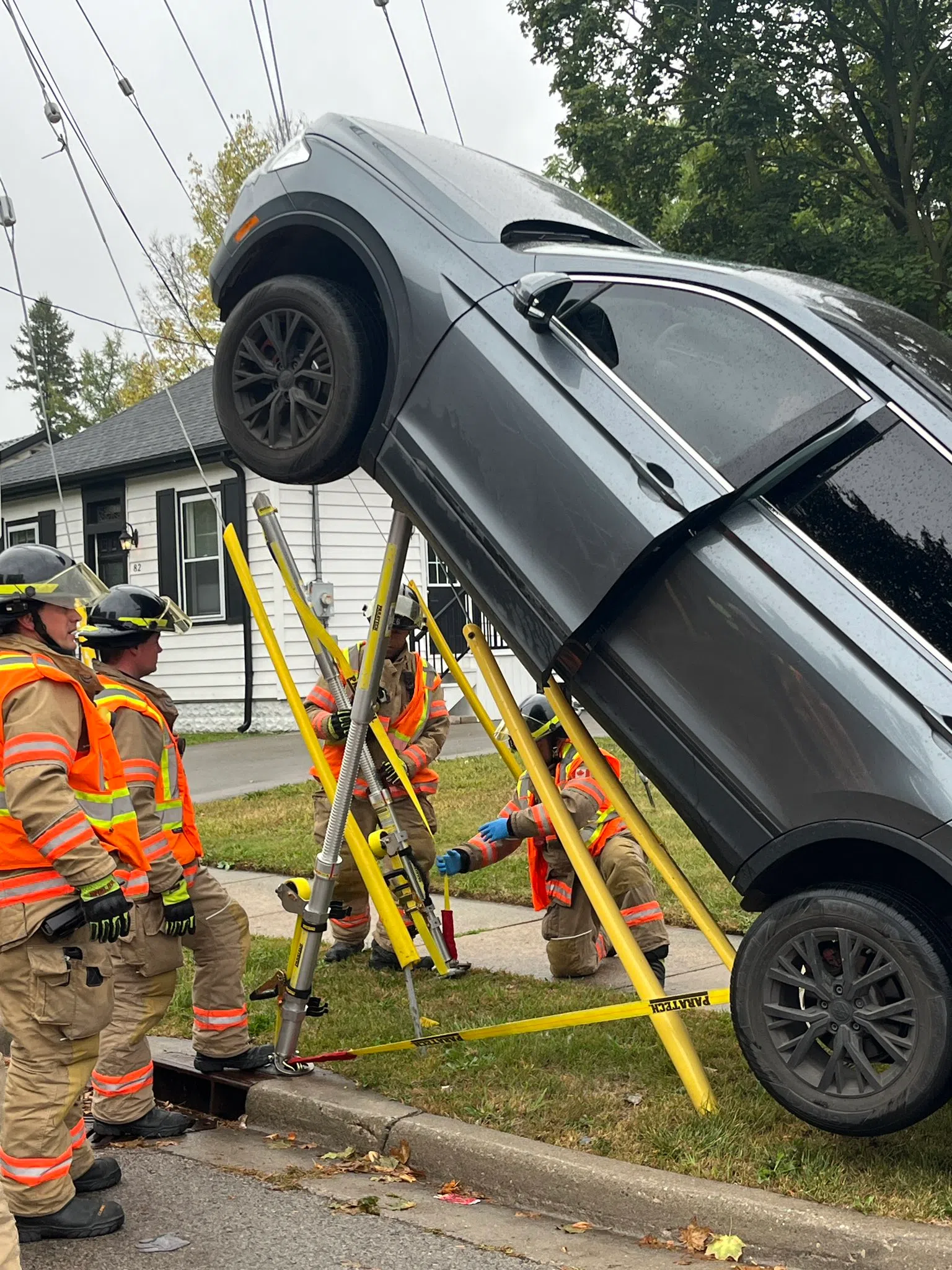 London fire and police respond to SUV on guy wires | 106.9 The X