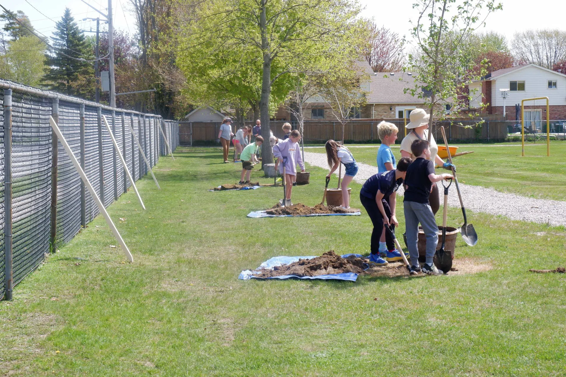 Partnership plants over 50 trees Thursday as part of school program ...