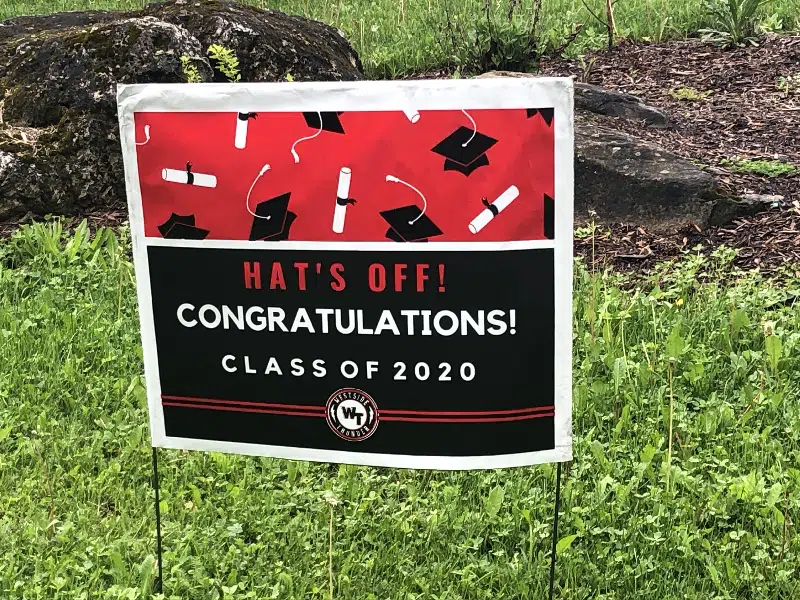 Westside Secondary School staff handing out congratulatory class of ...