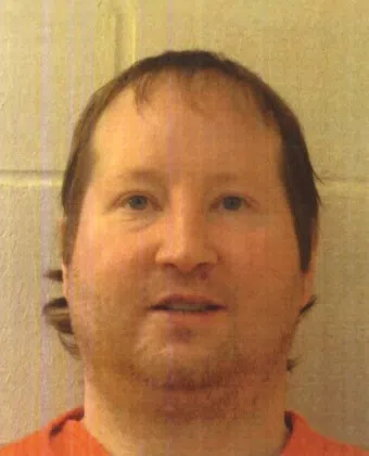 Murder suspect Eric Reinbold arrested in wooded area of northwest ...