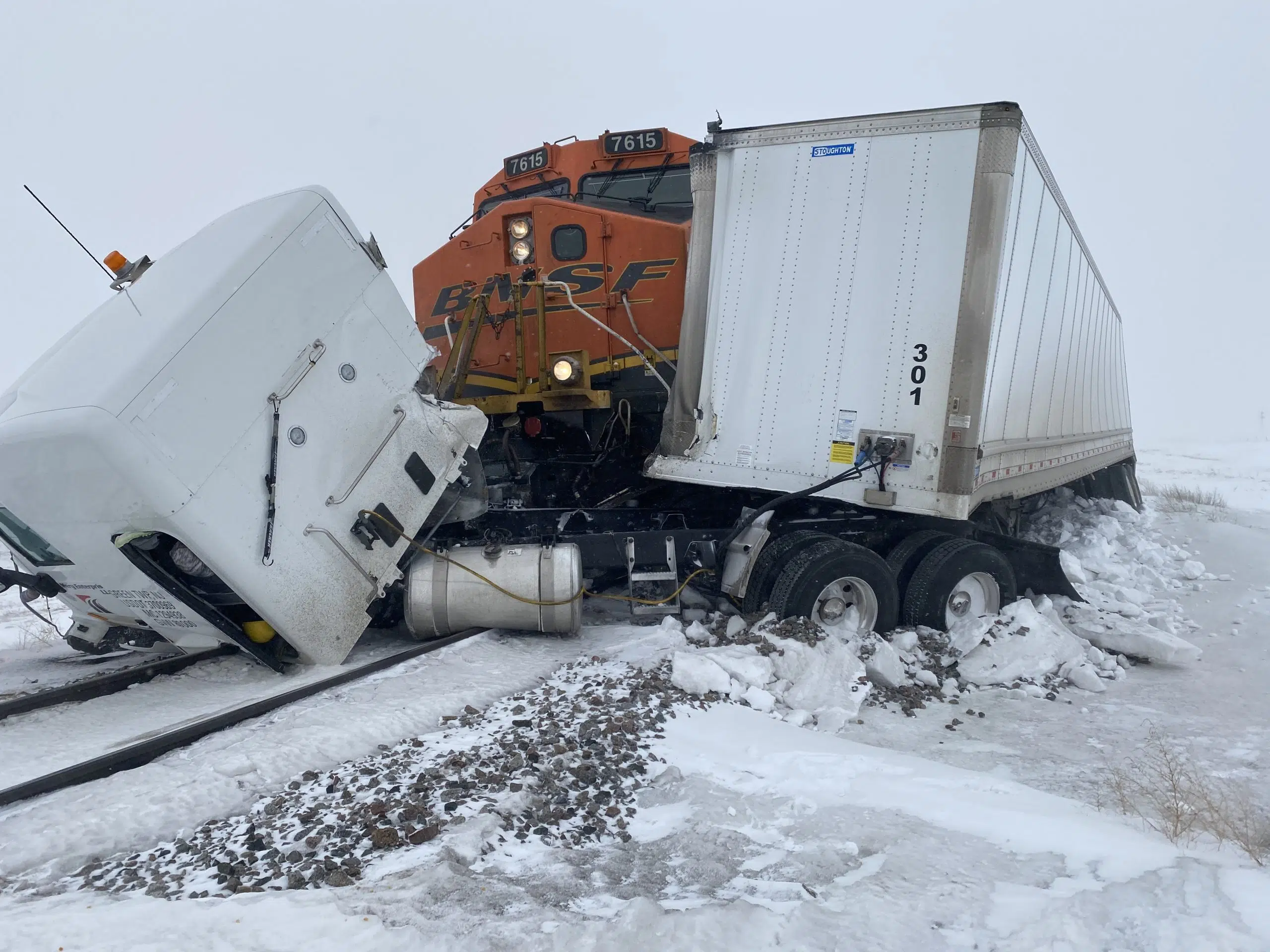 Semi driver escapes serious injury in collision with freight train ...
