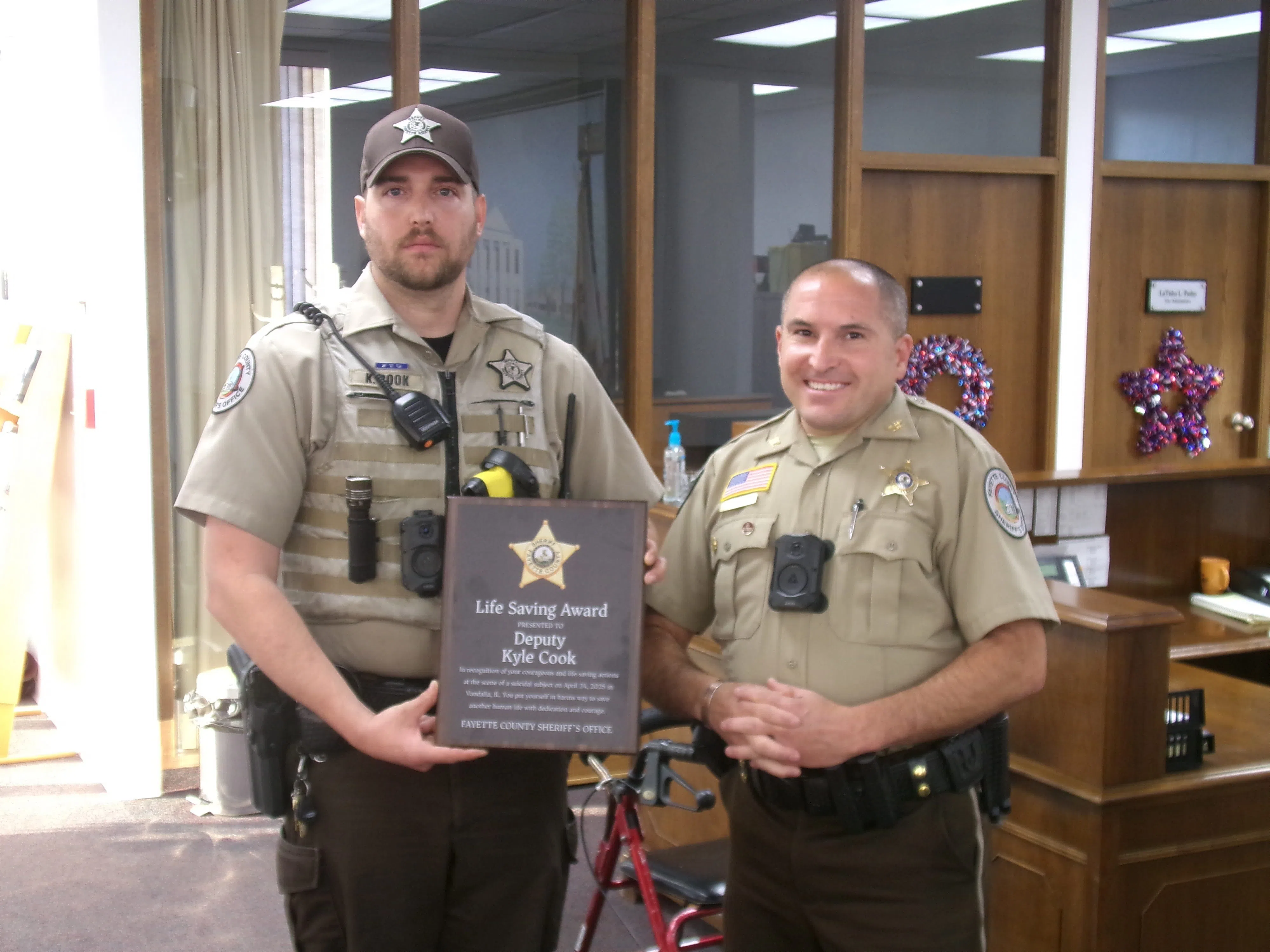 Deputy Kyle Cook presented with Life Saving Award during Tuesday’s Fayette County Board meeting ...