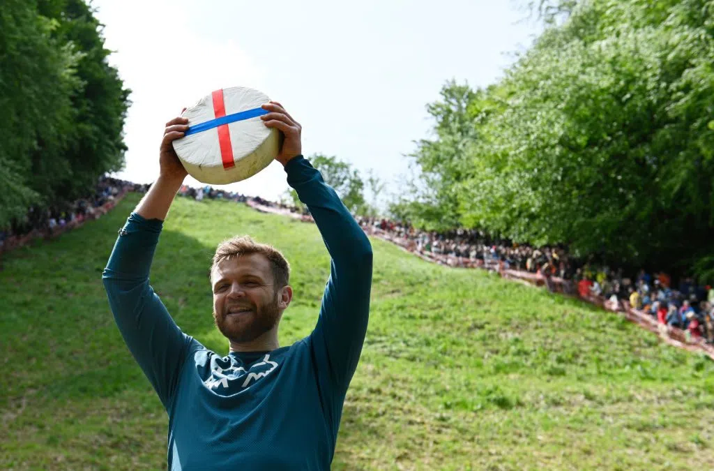 Woman Knocked Unconscious By Rolling Cheese Wedge Wins Cheese Rolling ...