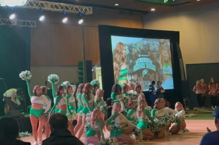 Pom-p and circumstance: Rider Cheer Team prepares to take the field in ...